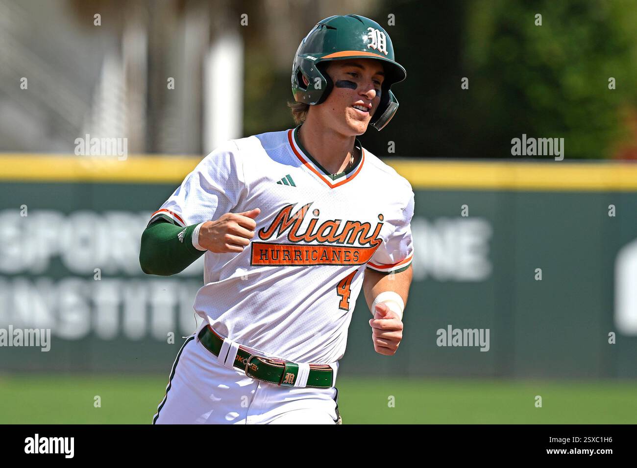 CORAL GABLES, FL - FEBRUARY 23: Miami infielder Jake Ogden (4) runs to ...