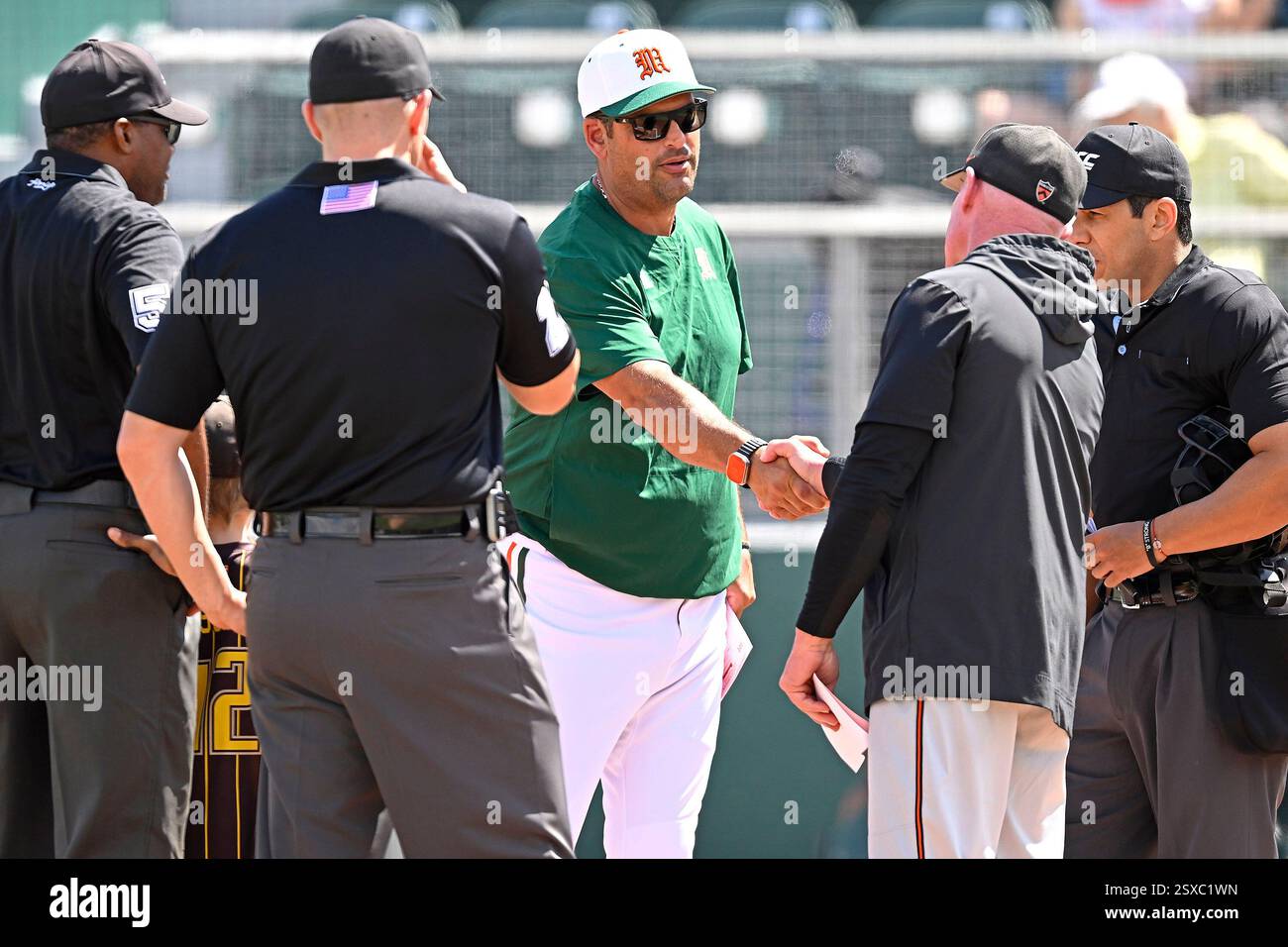 CORAL GABLES, FL - FEBRUARY 23: Miami head coach J.D. Arteaga shakes ...