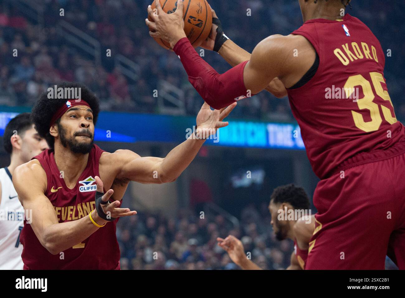 Cleveland Cavaliers' Isaac Okoro (35) grabs a rebound as teammate ...