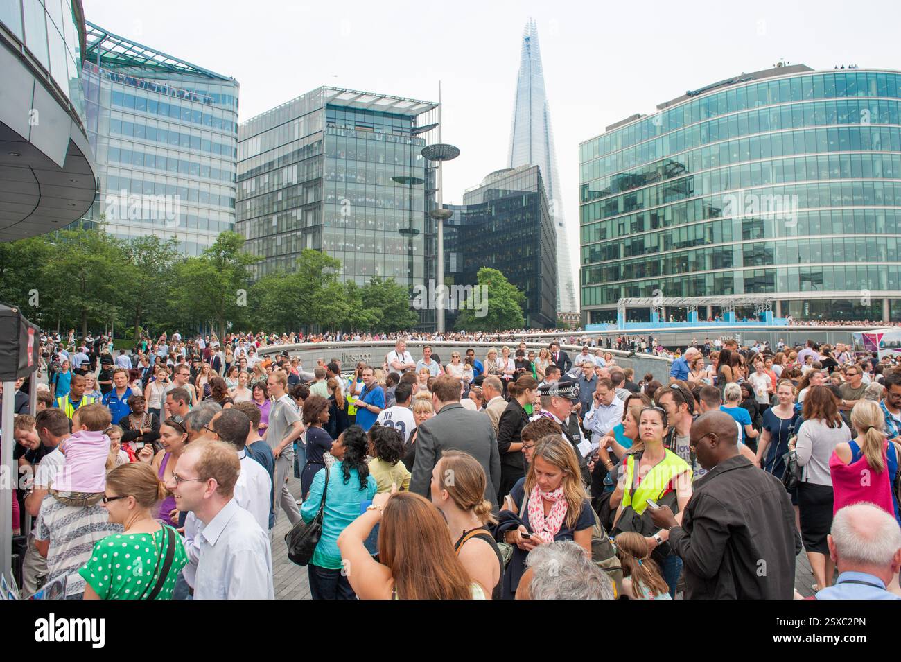 Large crowd gathers near the Shard and other modern buildings in London ...