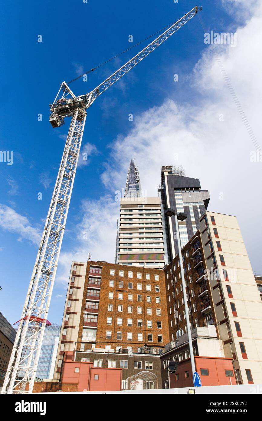 Construction crane at the Shard and surrounding buildings in London ...