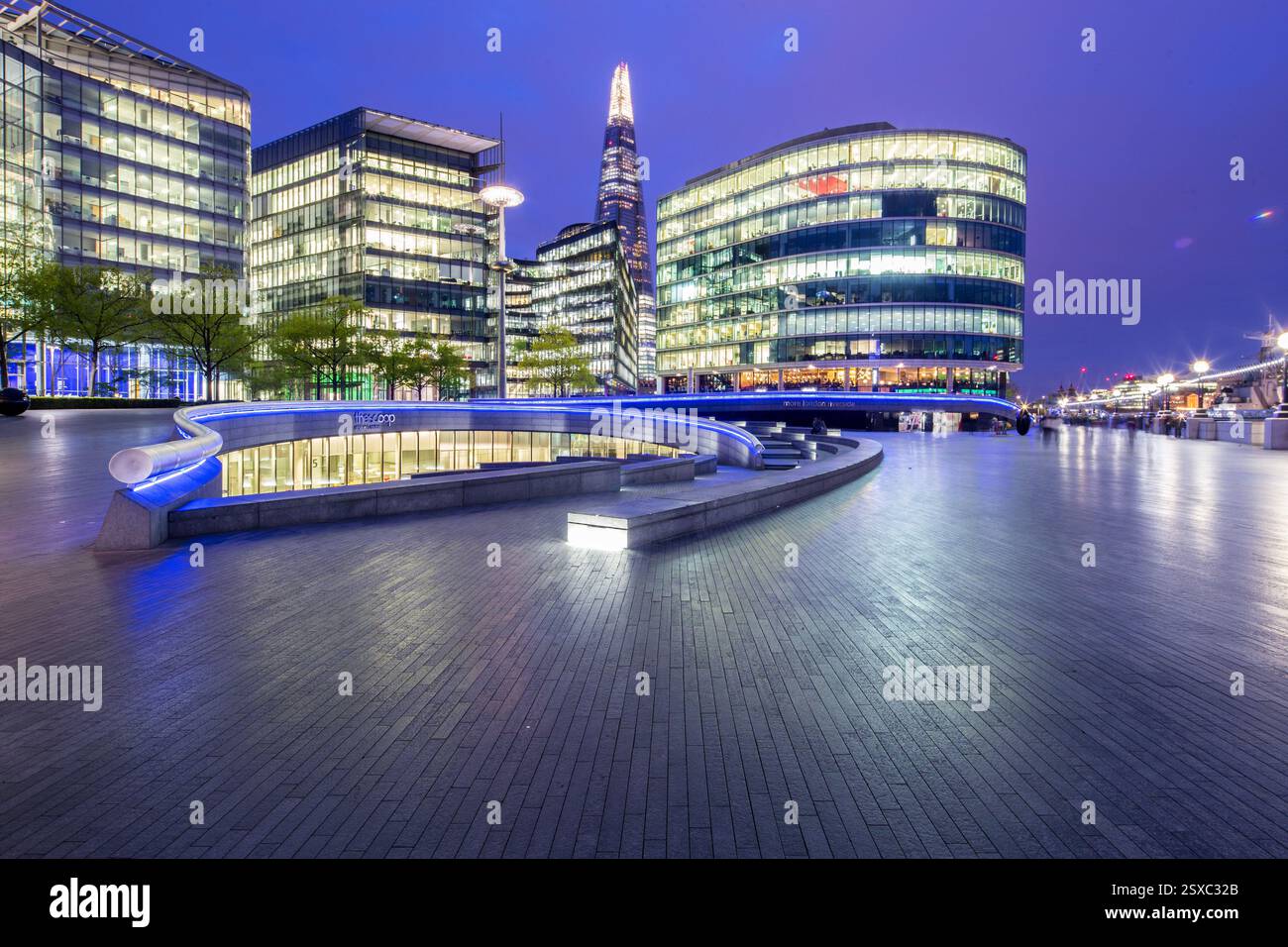 Evening view of the London Riverside, featuring modern office buildings ...