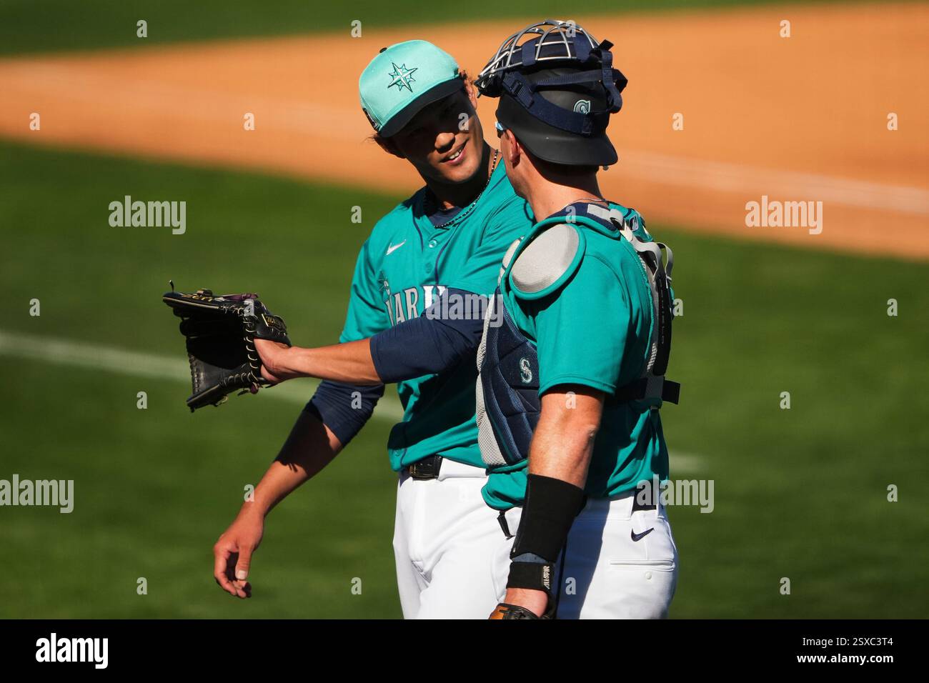 Seattle Mariners pitcher Shintaro Fujinami walks to the dugout with ...