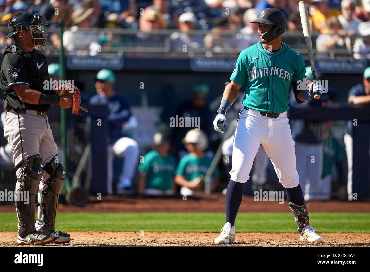 Seattle Mariners' Julio Rodriguez, right, looks over at Arizona ...