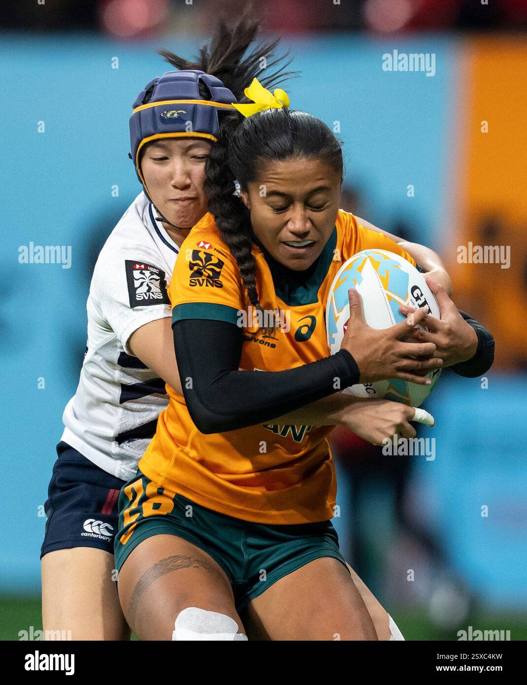 Japan's Natsumi Takahashi, left, stops Australia's Kiiahla Duff, right ...