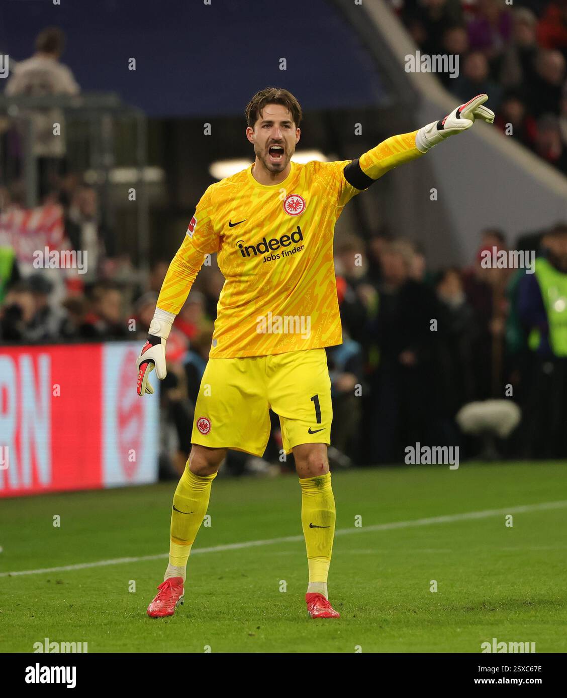 Munich, Germany. 23rd Feb, 2025. Eintracht Frankfurt's goalkeeper Kevin ...