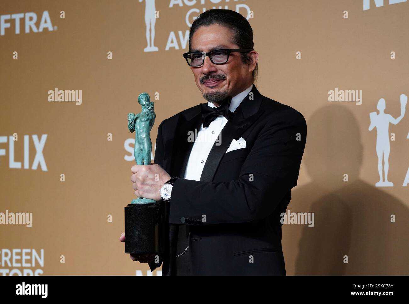 Hiroyuki Sanada poses in the press room with the award for outstanding ...