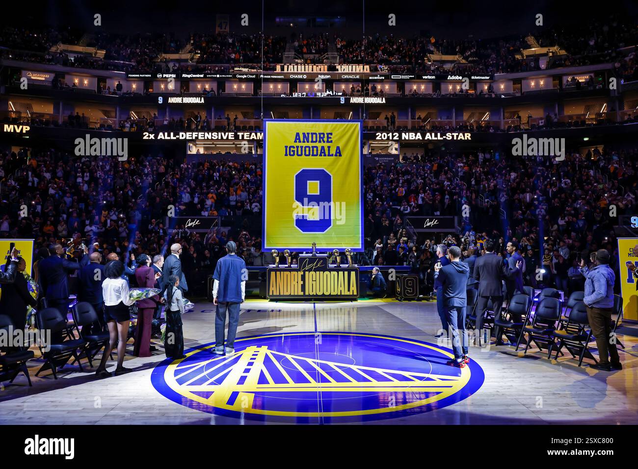 A ceremonial banner is lifted from the floor during a celebration ...