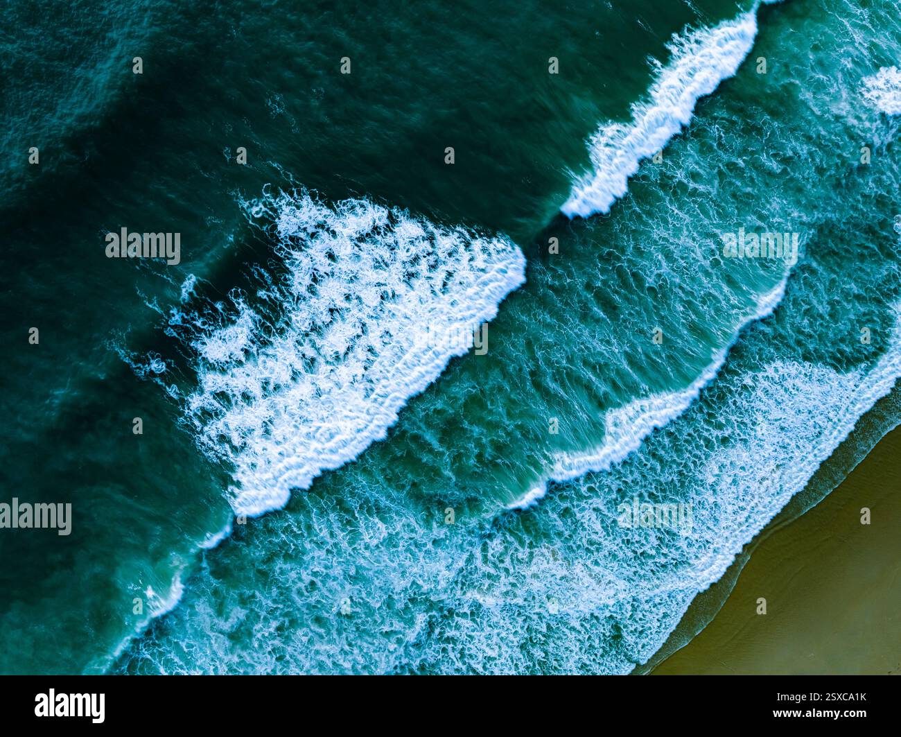Overhead view to blue stormy ocean waves with white foam in the ocean ...