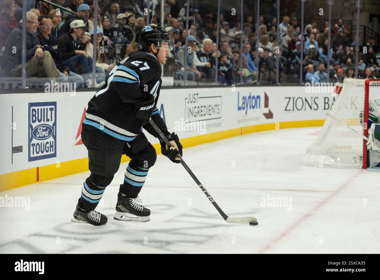 Utah Hockey Club Center Barrett Hayton Moves The Puck On The Ice