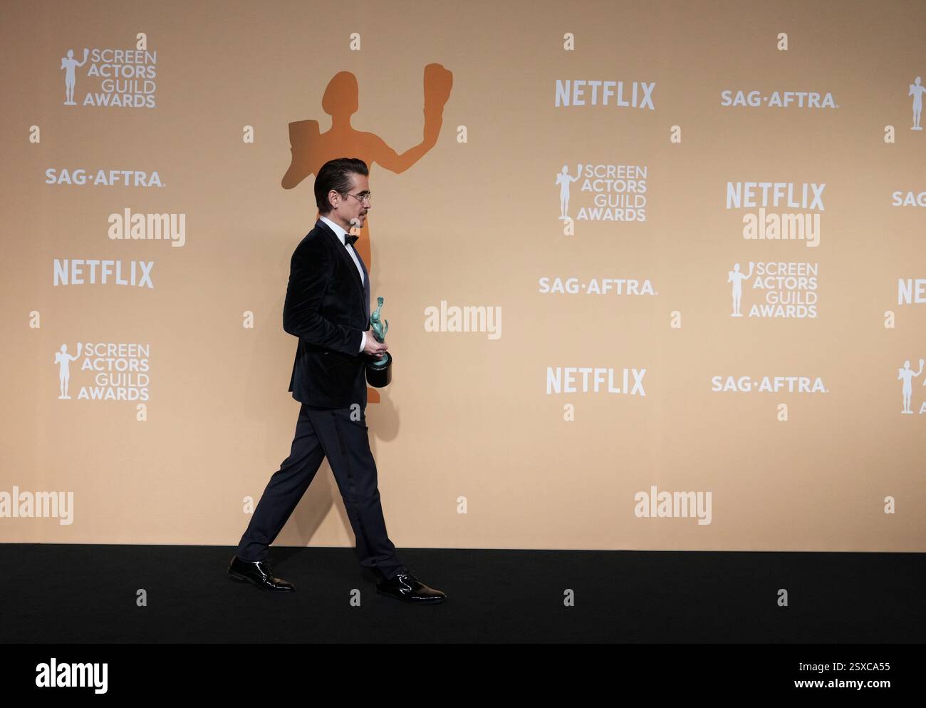 Colin Farrell poses in the press room with the award for outstanding ...