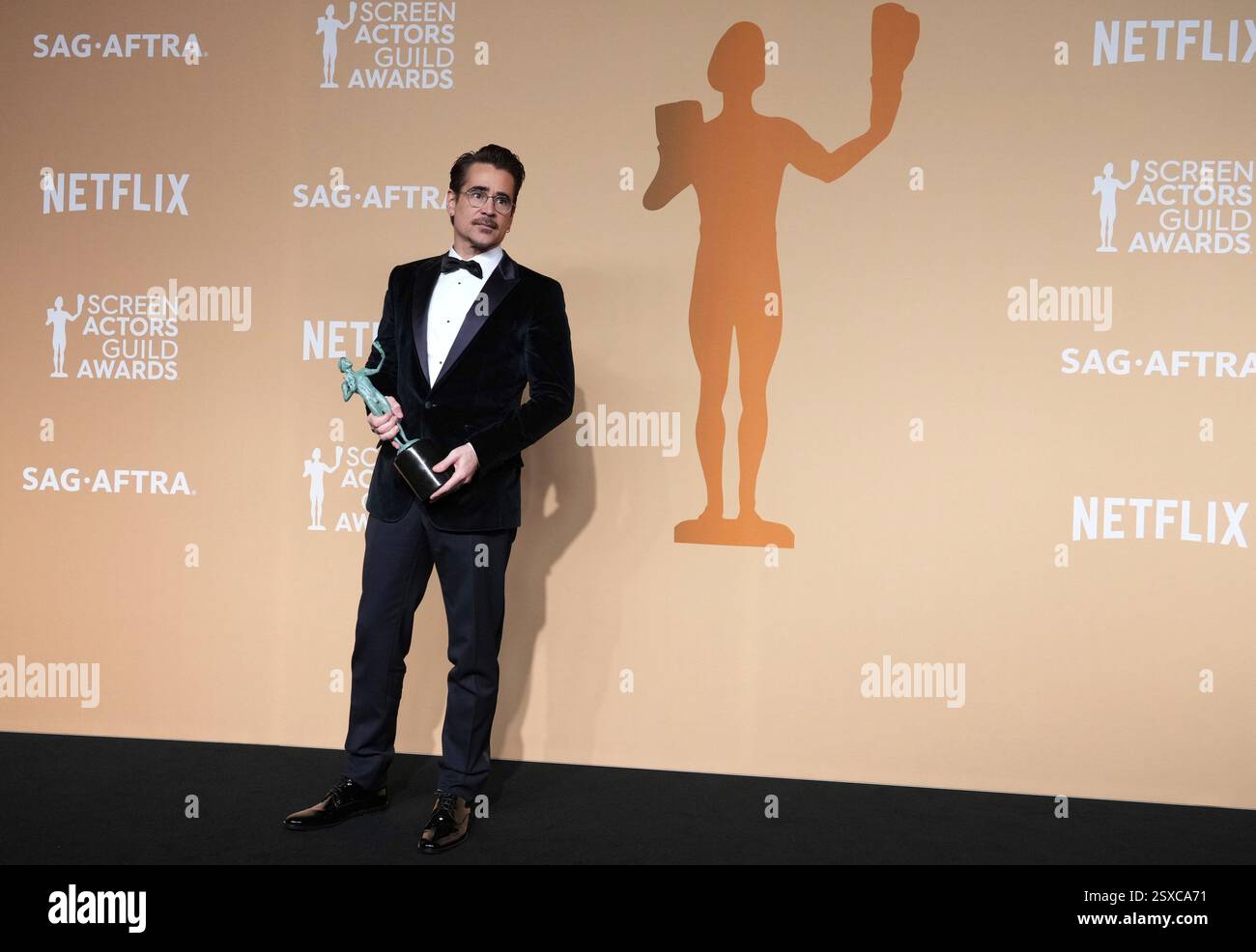 Colin Farrell poses in the press room with the award for outstanding ...