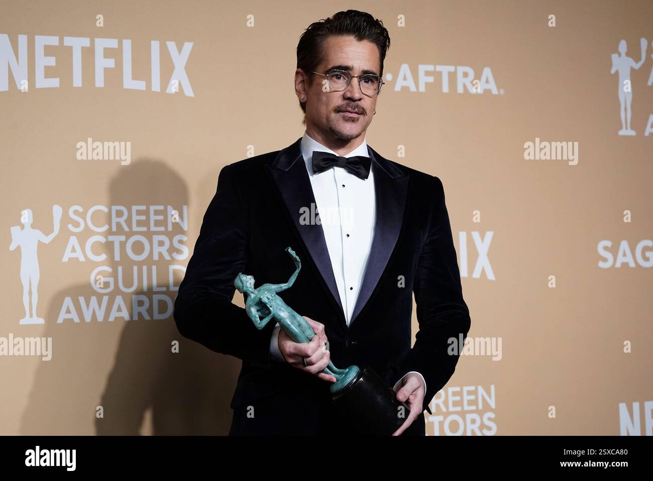Colin Farrell poses in the press room with the award for outstanding ...