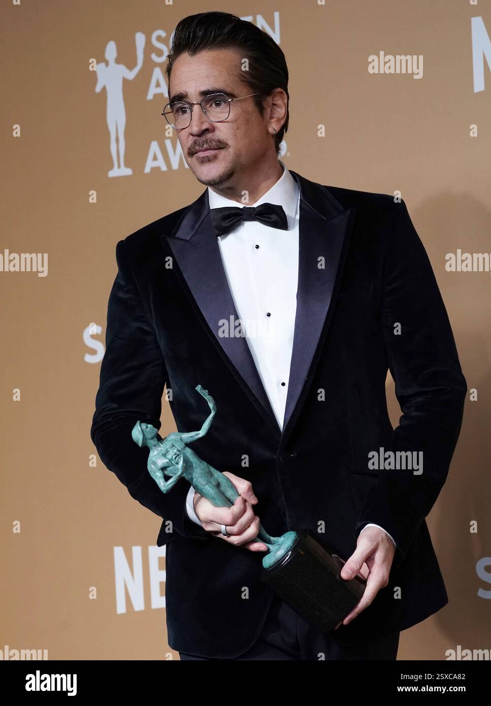 Colin Farrell poses in the press room with the award for outstanding ...