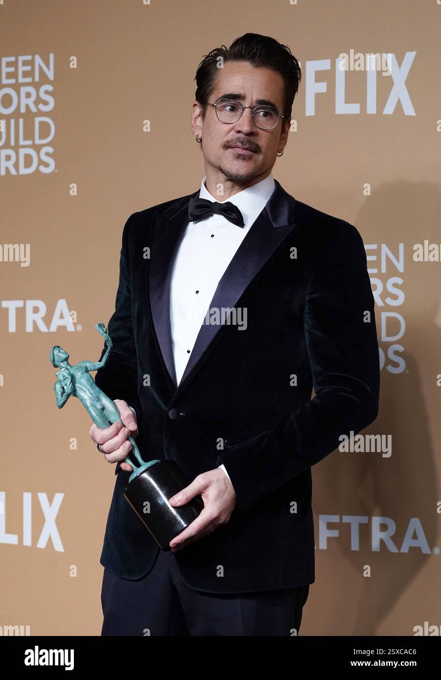 Colin Farrell poses in the press room with the award for outstanding ...