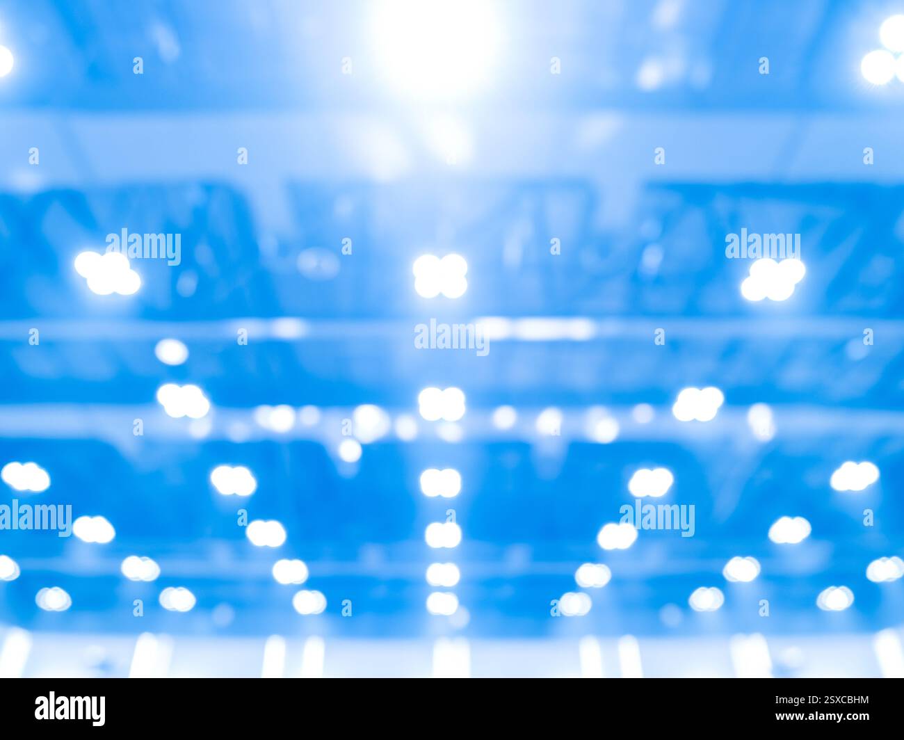 Blurry auditorium scene background for business presentation, blue tone ...