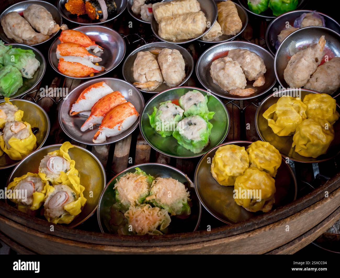 Various traditional food Chinese dim sum in mini bowls in large bamboo ...