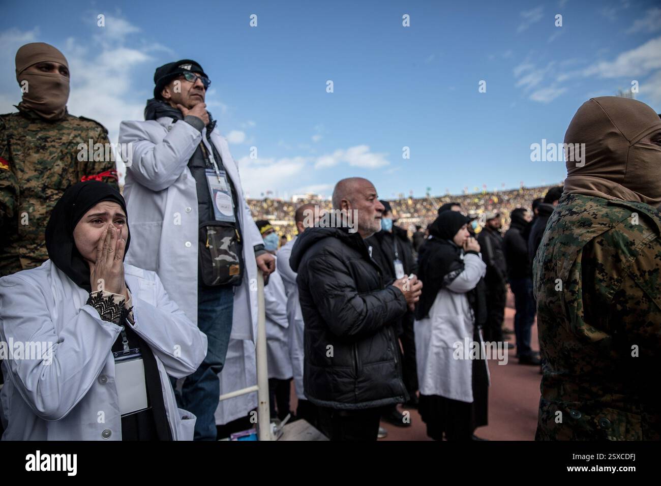 Beirut, Lebanon. 23rd Feb, 2025. Medics cry during the funeral ceremony ...