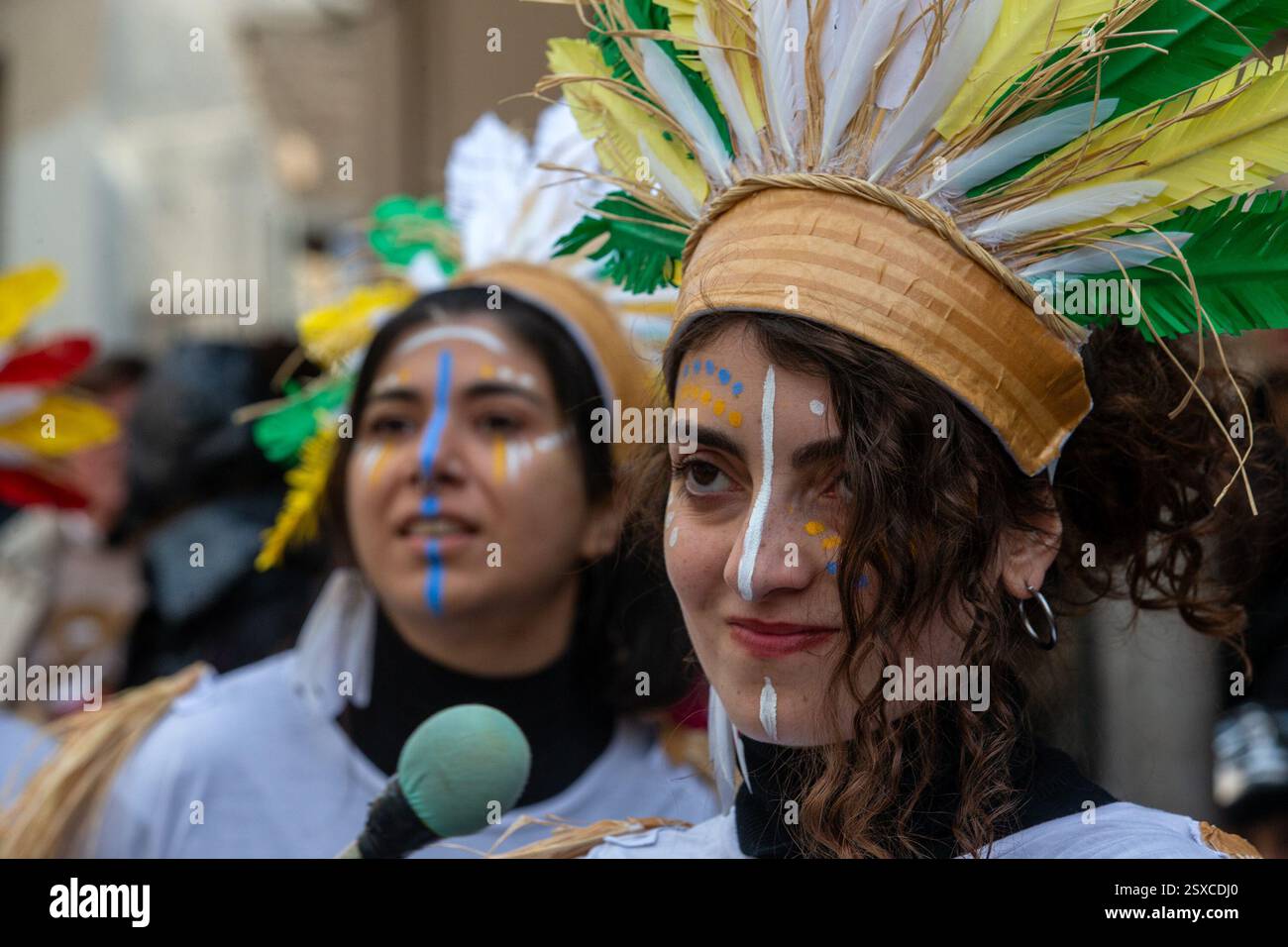 Athens, Greece. 23rd Feb, 2025. People dressed in costumes enjoy ...