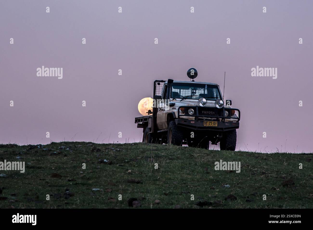 moon rise over a farm truck Stock Photo - Alamy