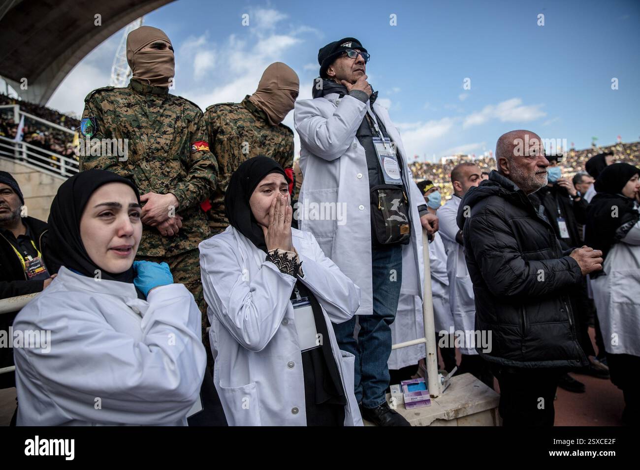 Beirut, Lebanon. 23rd Feb, 2025. Medics cry during the funeral ceremony ...