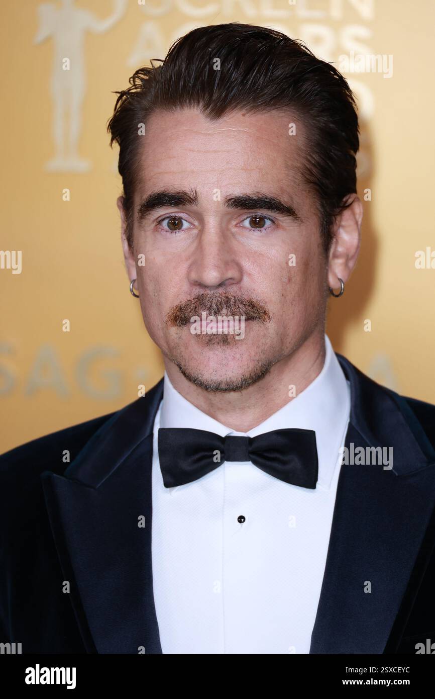 Colin Farrell walking on the red carpet at the 31st Annual Screen ...