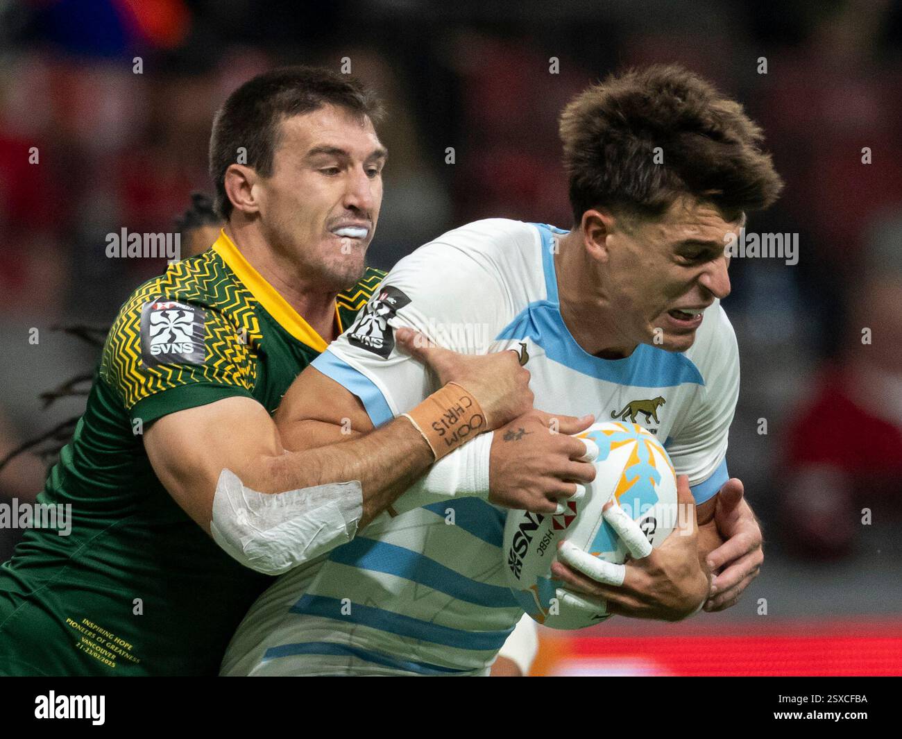 Argentina's Matteo Graziano runs the ball as South Africa's Impi Visser ...
