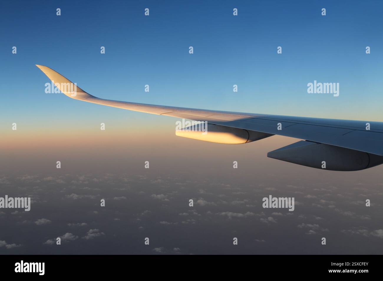 Airplane window view of sunset overlooking Doha, Qatar Stock Photo - Alamy