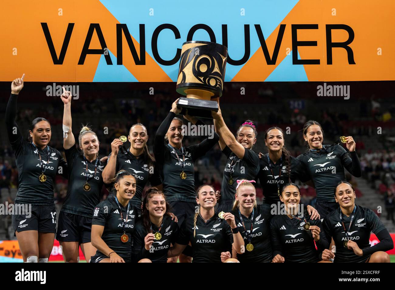 New Zealand's Sarah Hirini, and Theresa Setefano lift a trophy as their ...