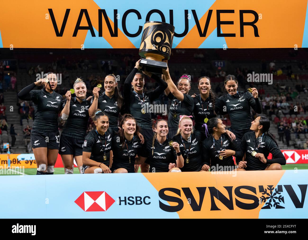New Zealand's Sarah Hirini, and Theresa Setefano lift a trophy as their ...