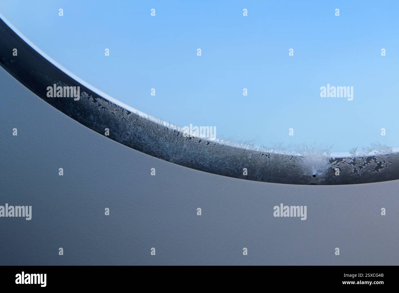Flake ice on the airplane window Stock Photo - Alamy