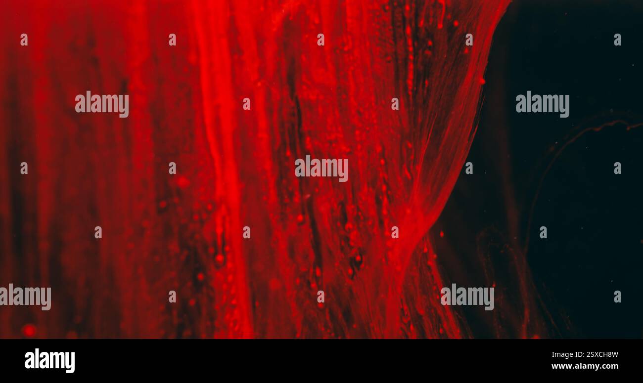 Blur falling flow. Water paint dripping. Defocused red color shine ...