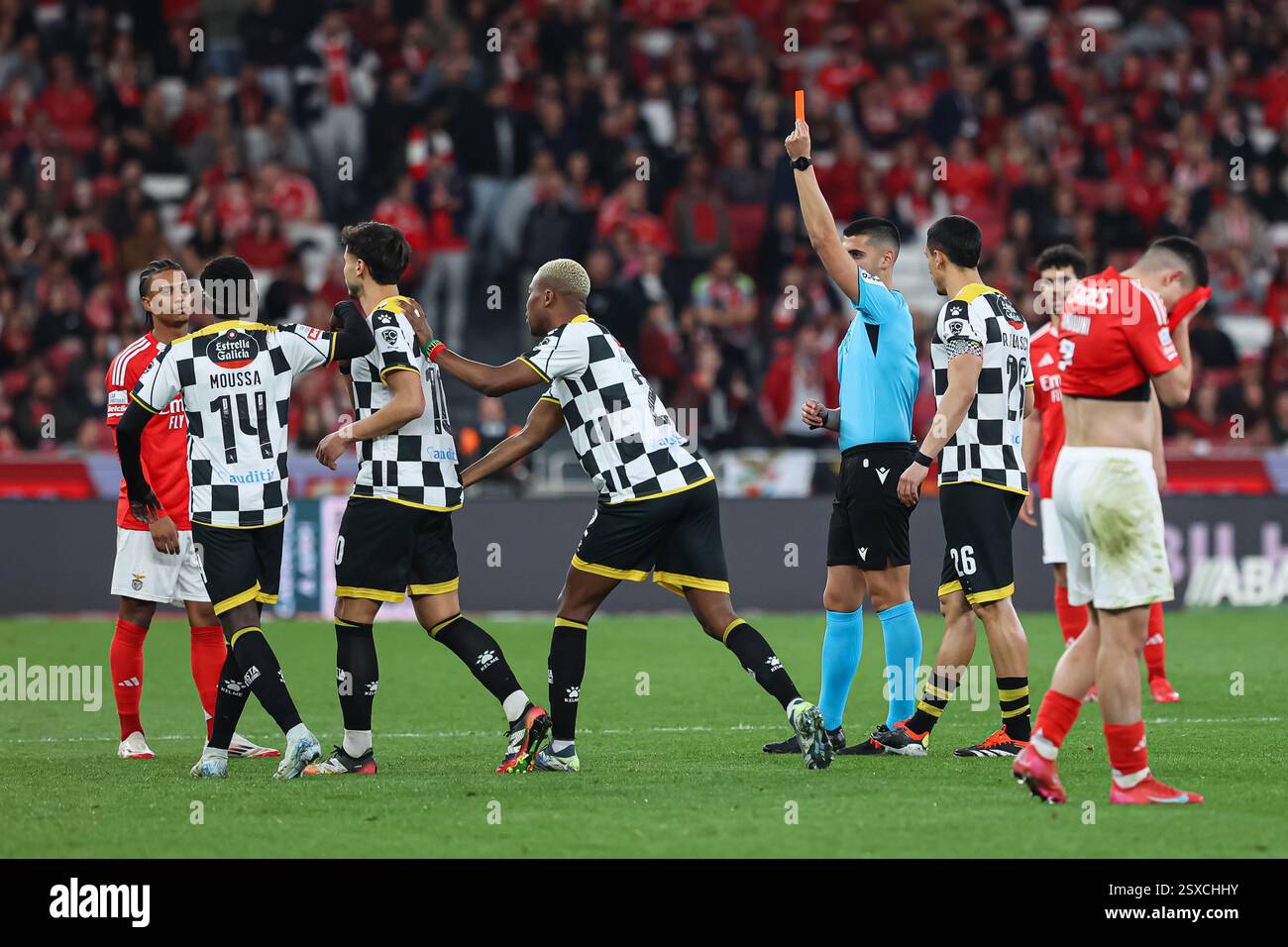Lisbon, Portugal. 22nd Feb, 2025. Referee Jose Bessa shows a red card ...