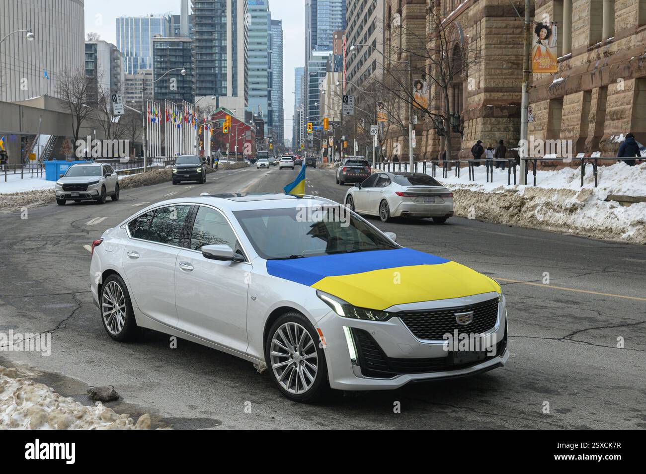 Toronto, ON, Canada – February 23, 2025: A car with a Ukrainian flag on ...