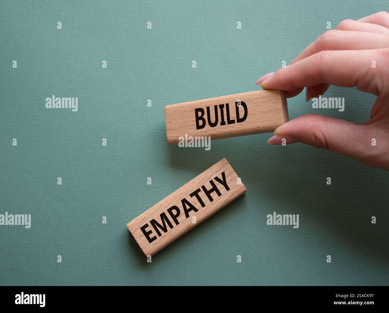 Build empathy symbol. Wooden blocks with words Build empathy ...
