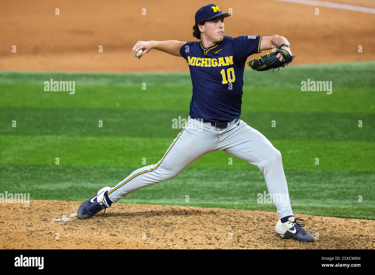 February 23, 2025: Tate Carey (10) of Michigan in action on the mound ...