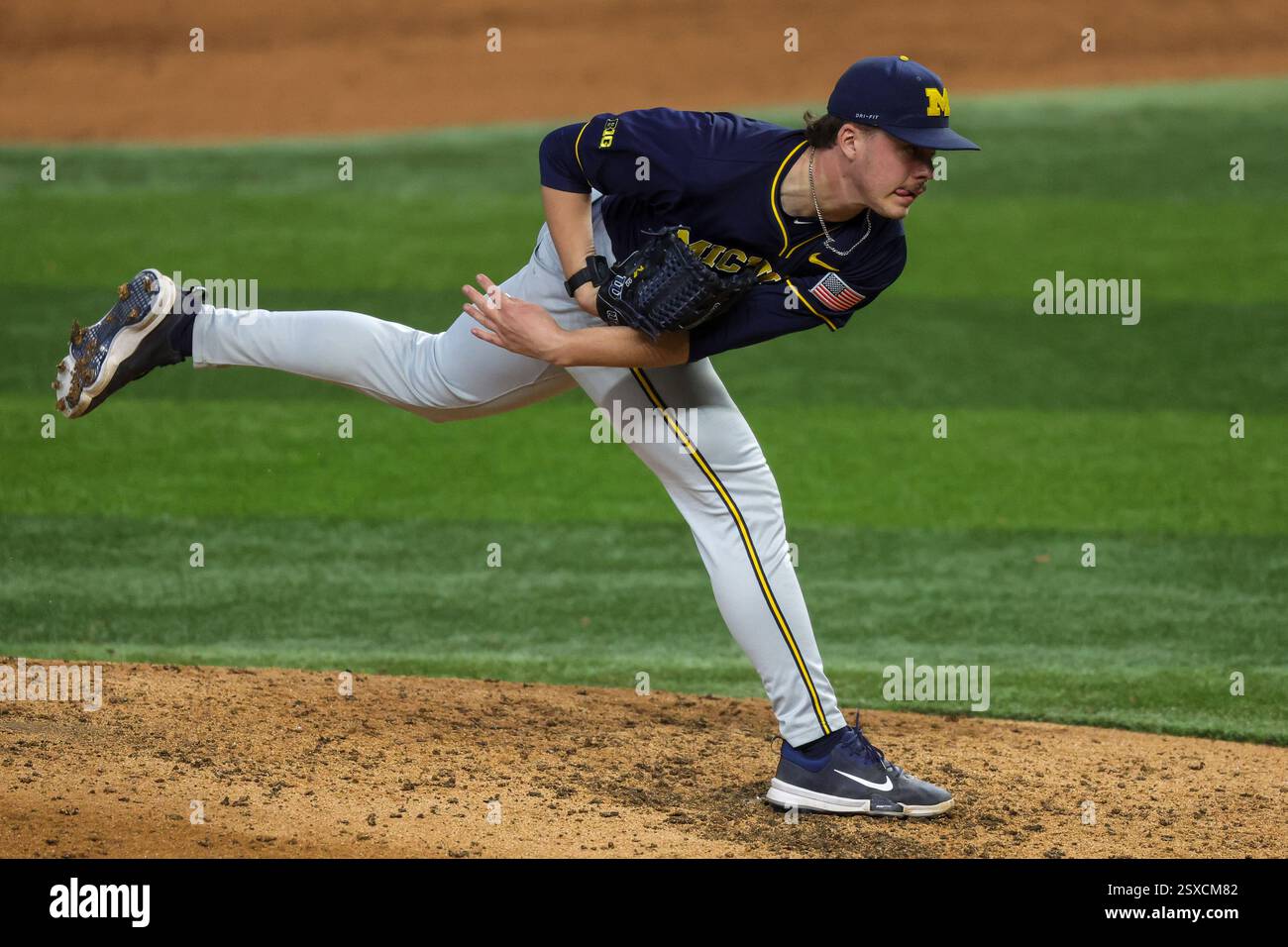 February 23, 2025: Michigan pitcher Wyatt Novara (22) finishes up his ...