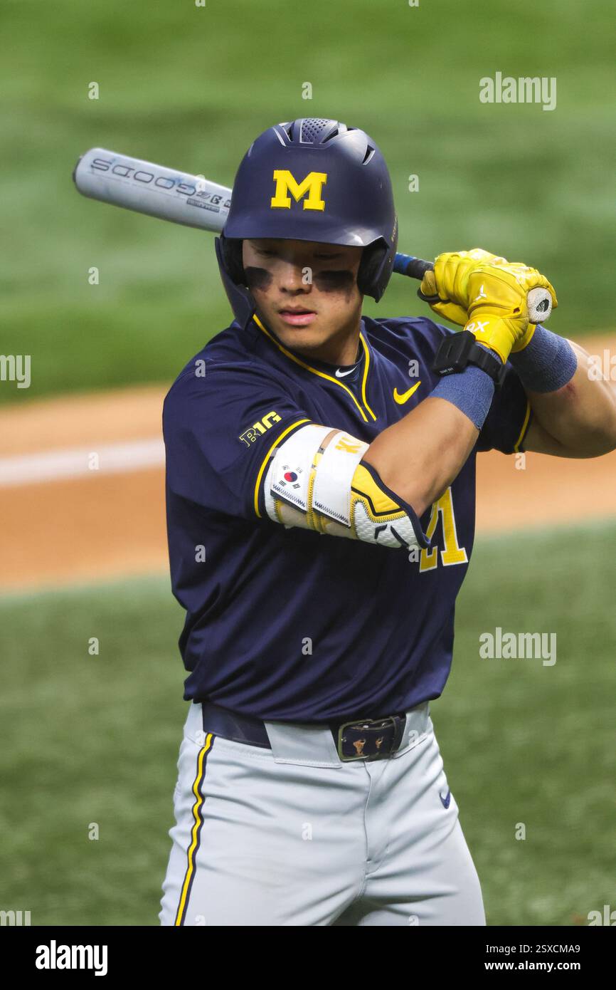 February 23, 2025: Jonathan Kim (21) of Michigan stands in the on deck ...