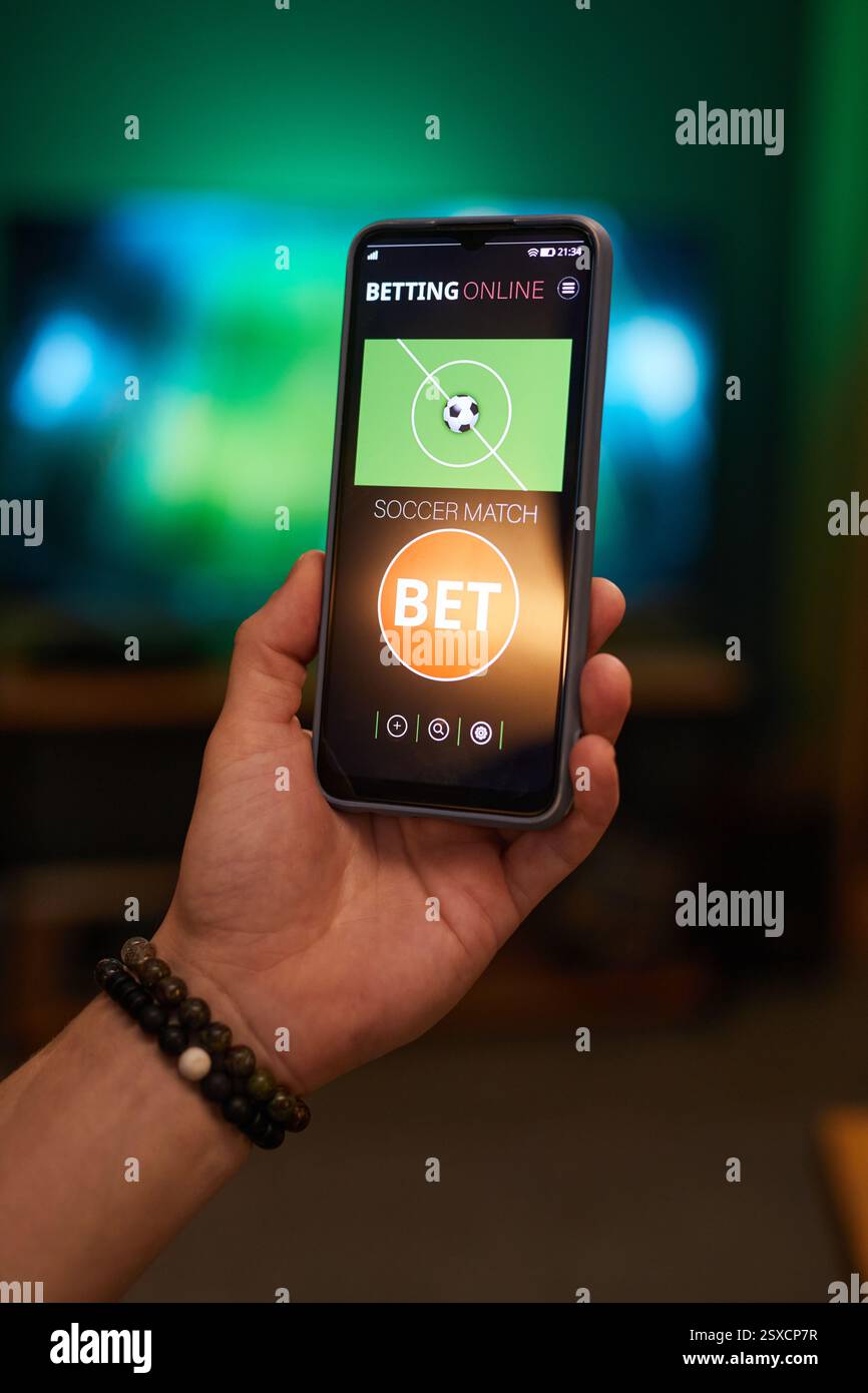 Hand Holding Smartphone Displaying Betting App Interface Stock Photo ...
