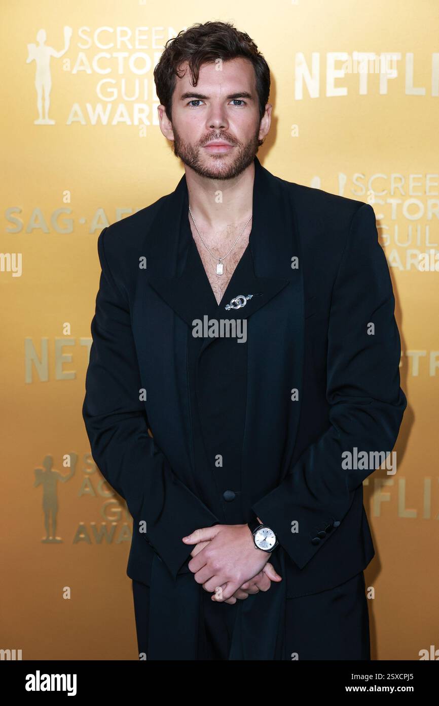 Luke Newton walking on the red carpet at the 31st Annual Screen Actors ...