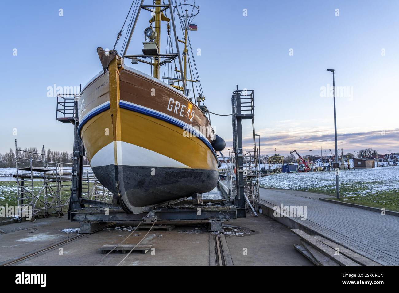 The fishing village of Greetsiel, historic fishing harbour, with the ...