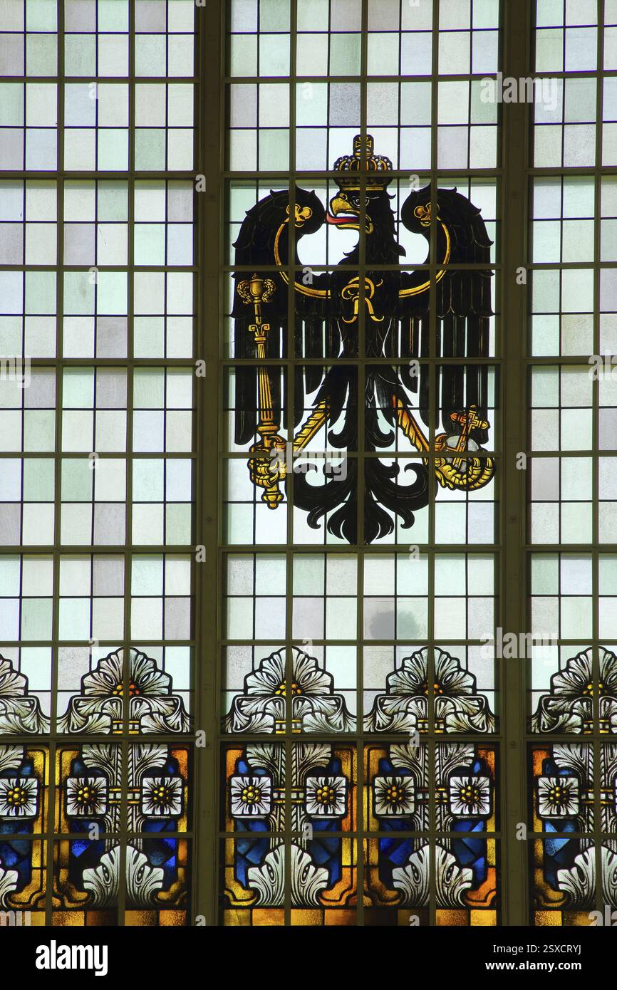 Stained glass window with German imperial eagle and floral decorations ...