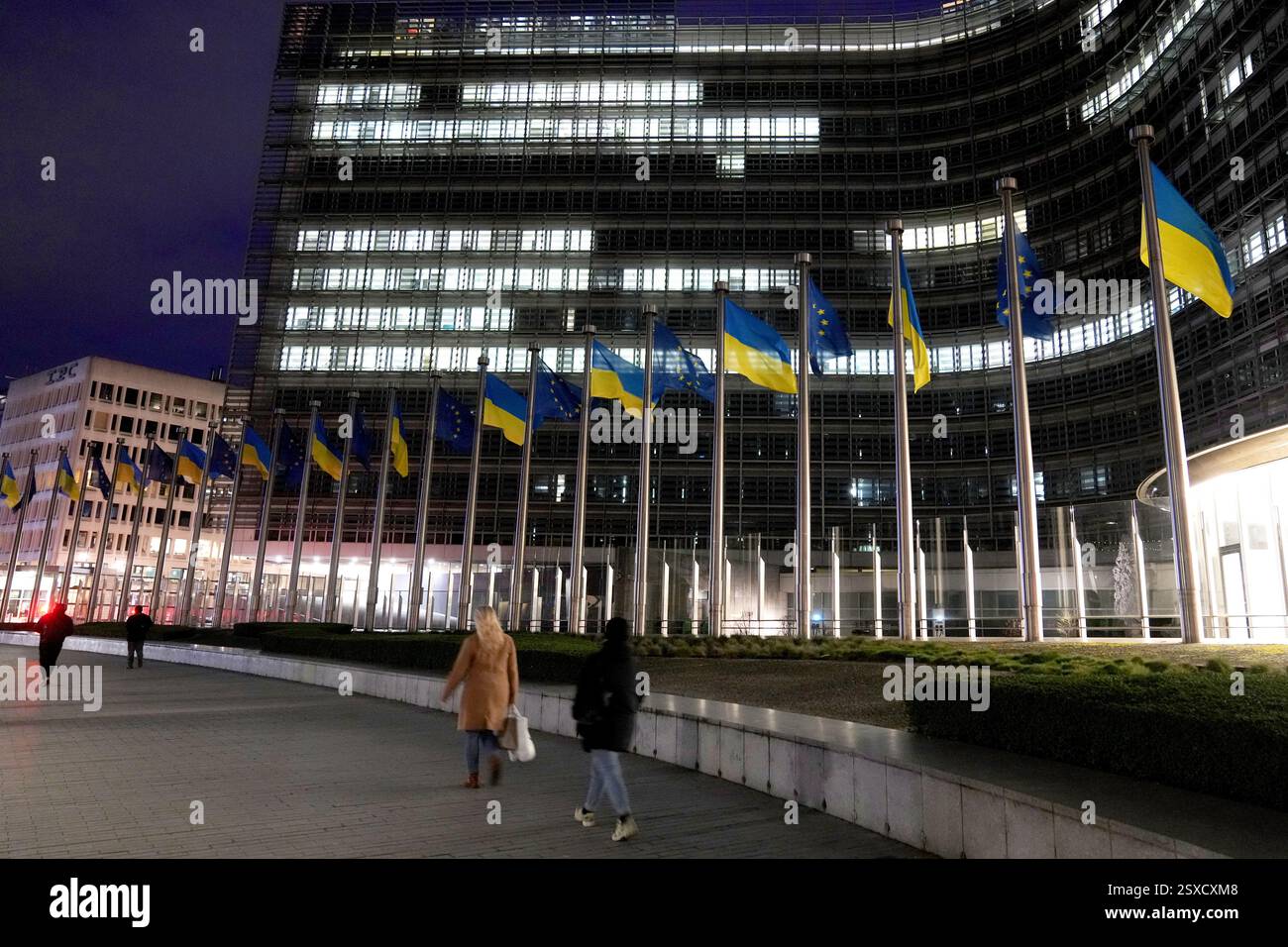 The European Union and Ukrainian flags flap in the wind to mark the ...