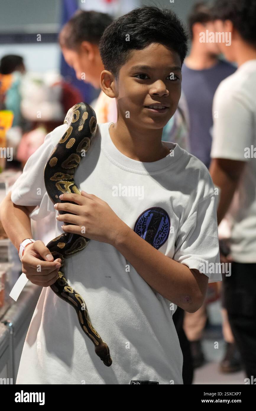 Manila, Philippines.22th February 2025. A visitor interacts with a ...