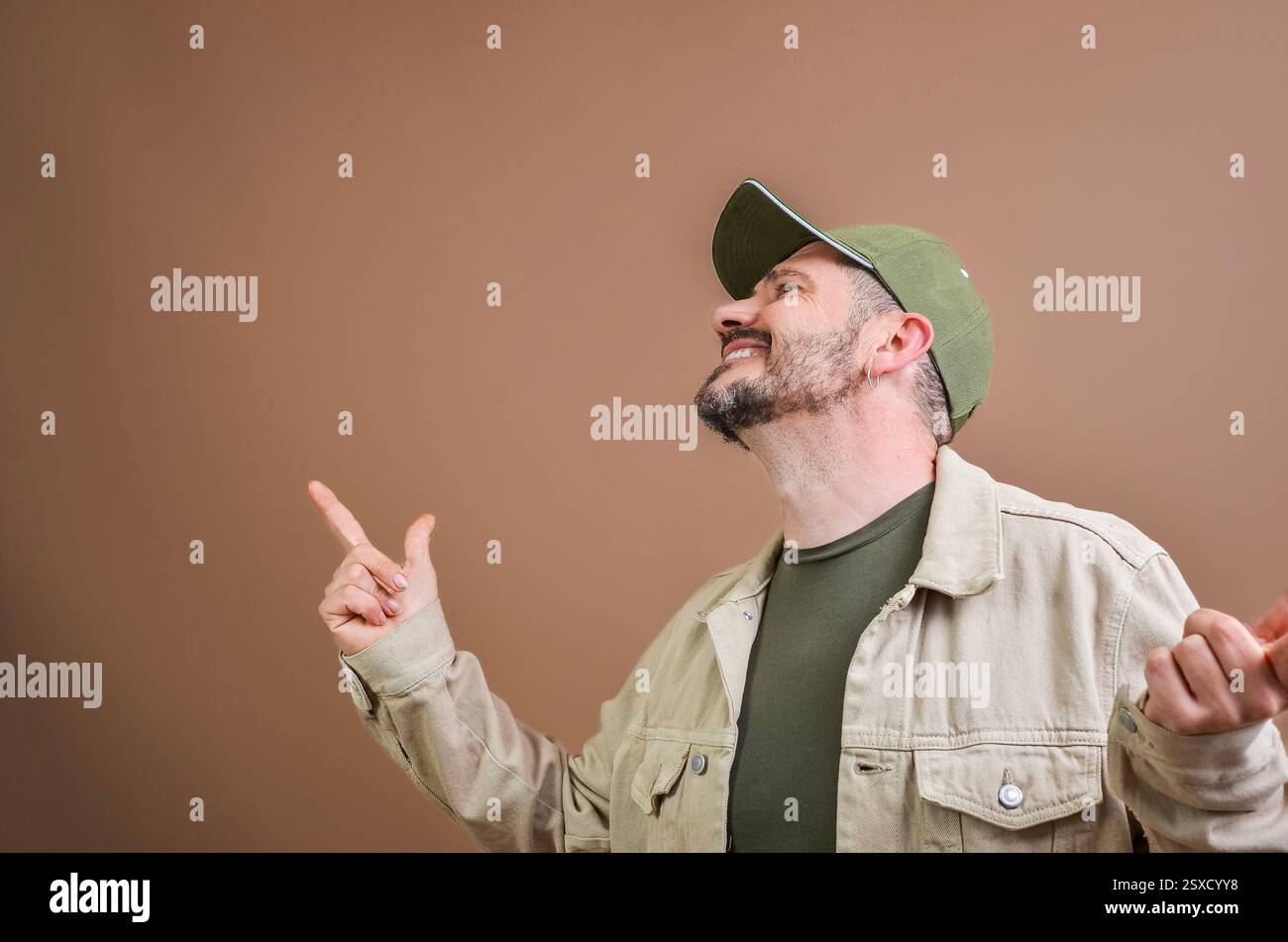 Technician pointing with his index finger to the top right corner ...