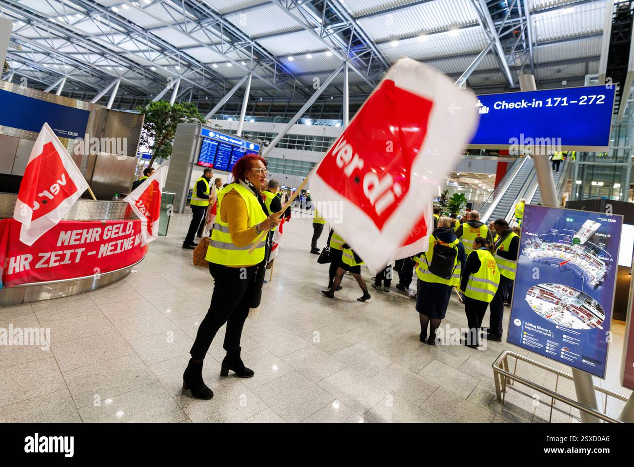 Duesseldorf, Germany. 24th Feb, 2025. Ground staff stand in the ...