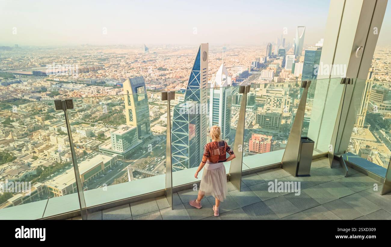 Tourist enjoying breathtaking panoramic views of Riyadh's skyline ...