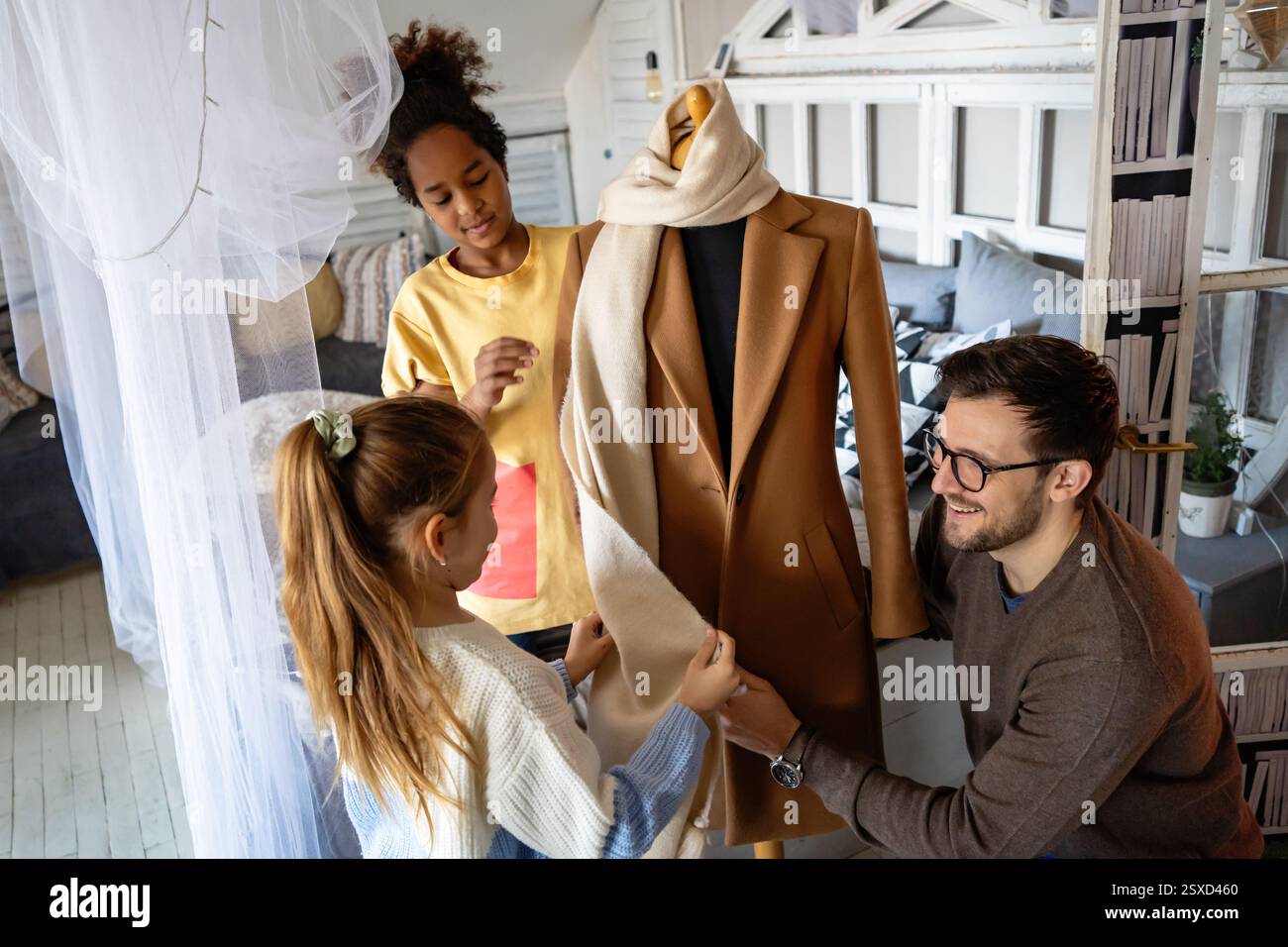 Smiling single parent father playing fashion designer with his ...
