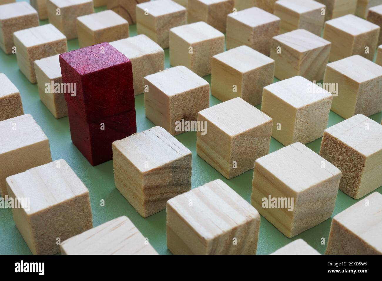 One unique cube stands out among aligned blocks. Individuality and ...