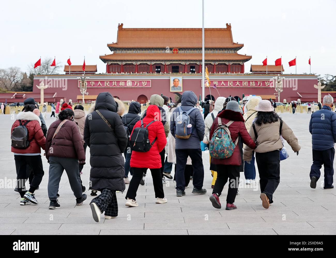 Tourists visit the Tiananmen Square amid cold air in Beijing, China, 21 ...